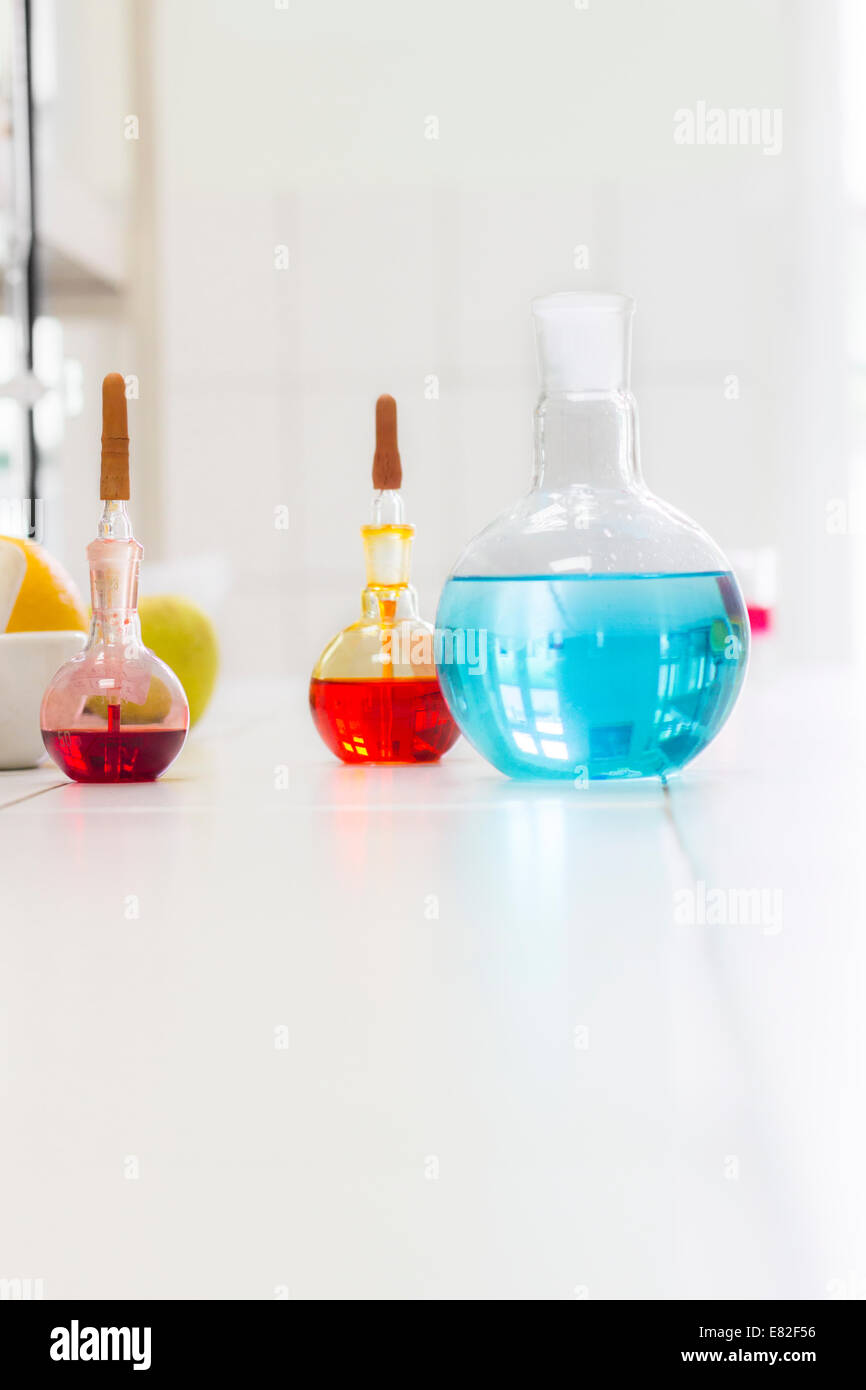 Scientific experiment: medical samples in testing tubes and cylinders ...