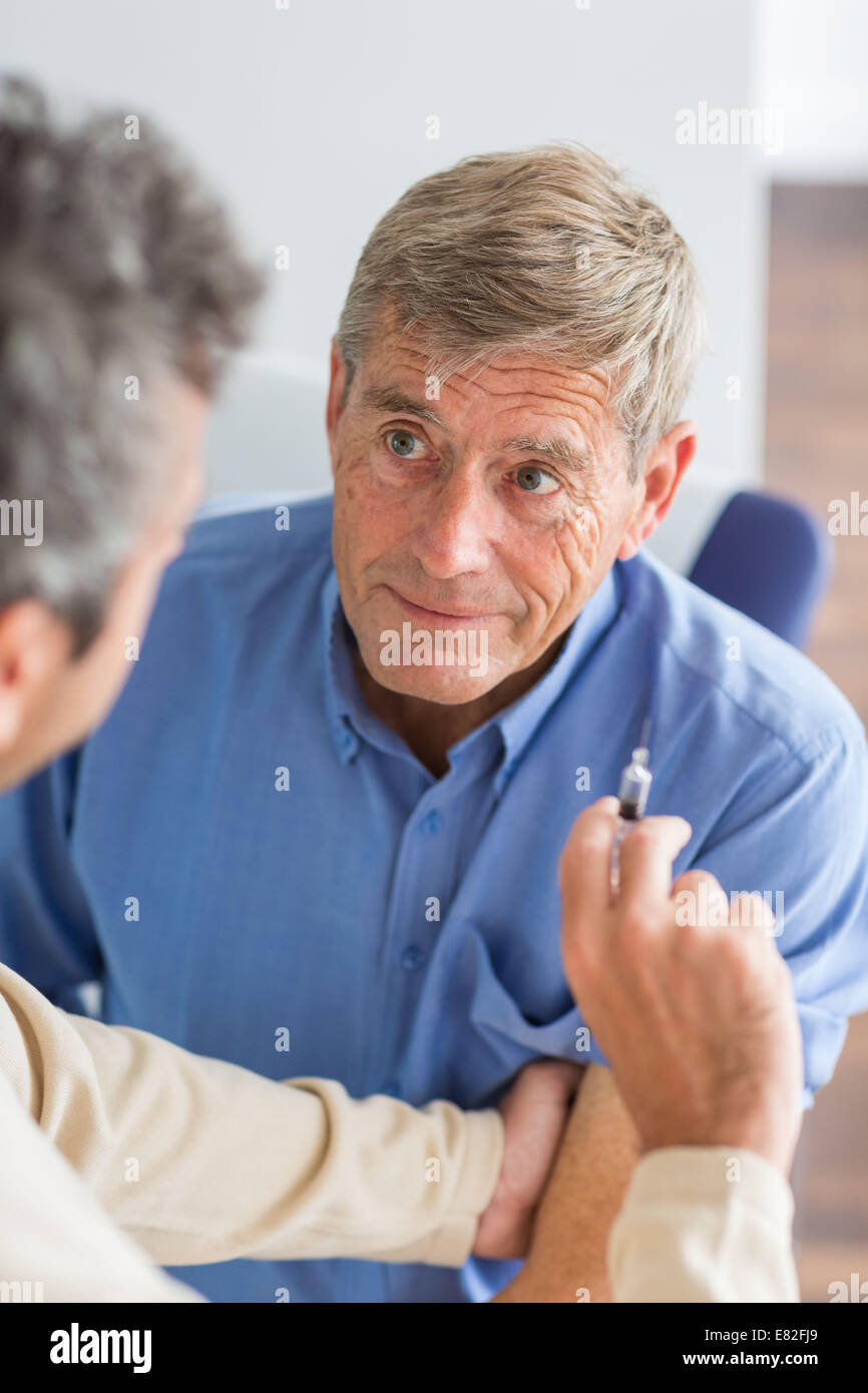 Man receiving vaccination Stock Photo - Alamy