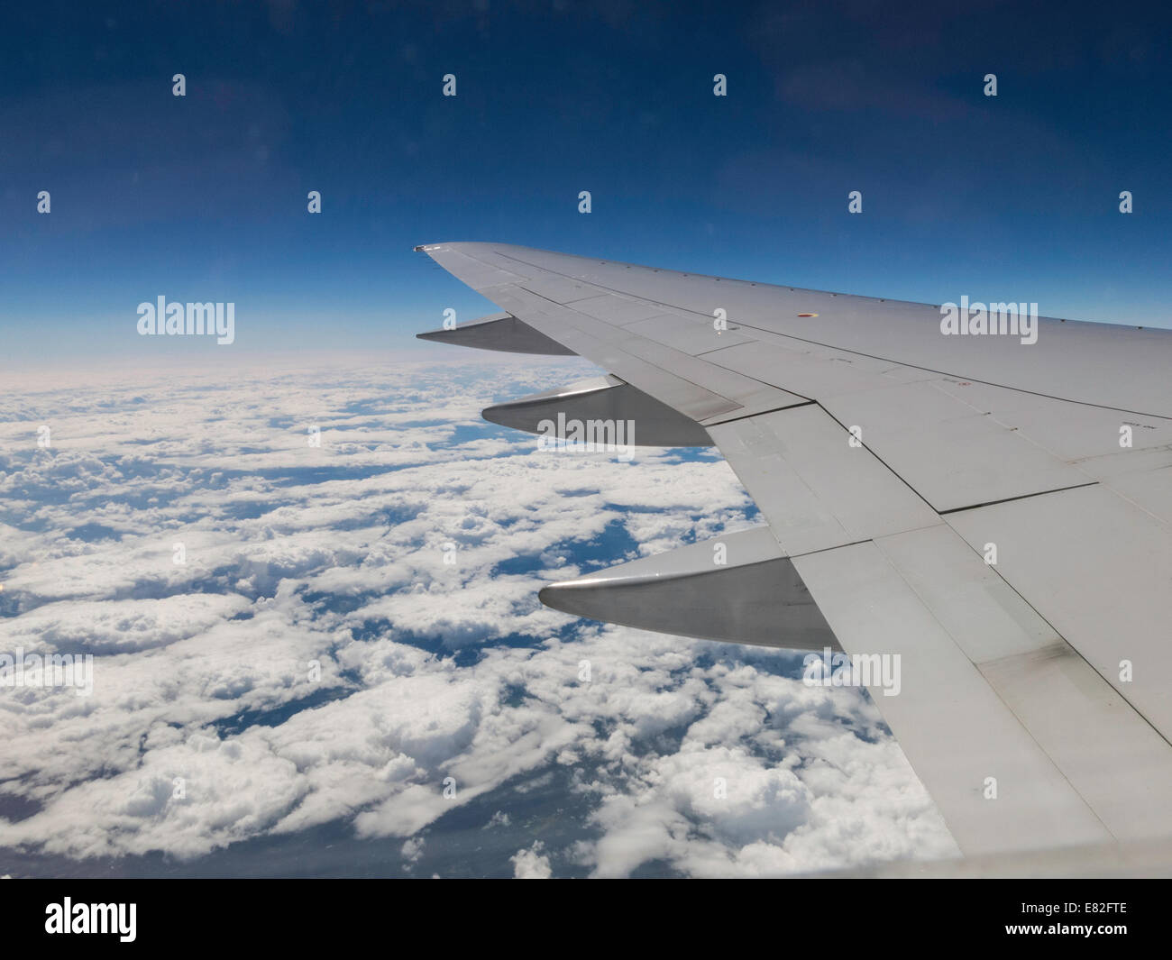 Jet Plane Wing from Cabin Window in Flight Stock Photo - Alamy