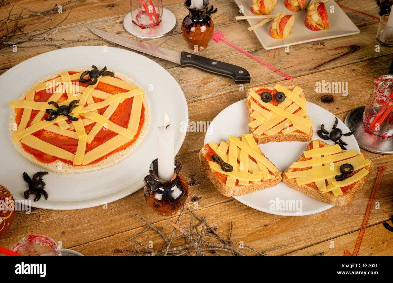 Halloween party table with assorted spooky snacks Stock Photo - Alamy