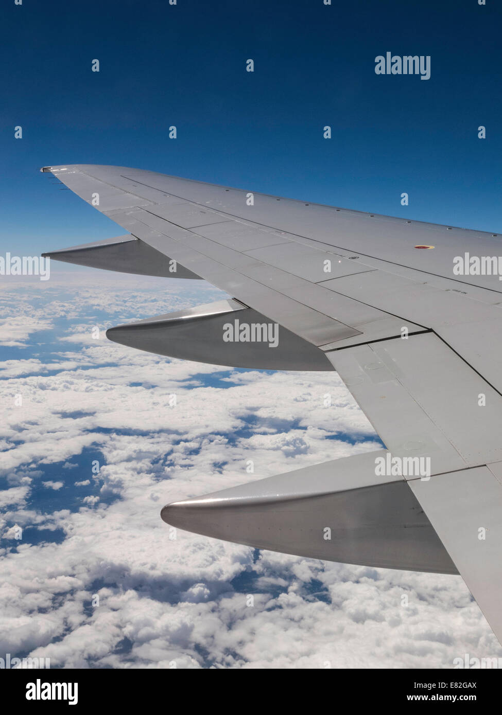 Jet Plane Wing from Cabin Window in Flight Stock Photo - Alamy