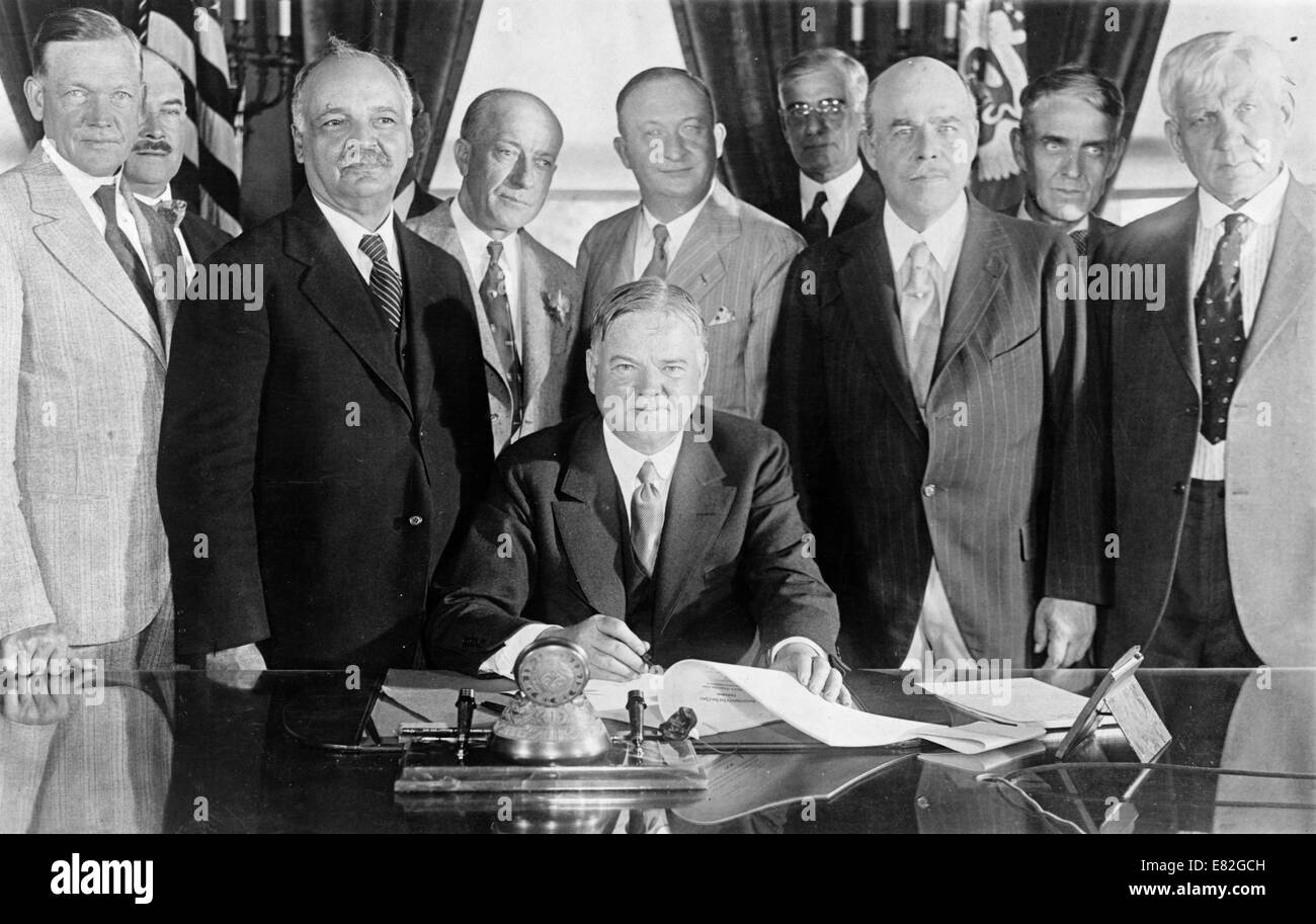 President Hoover signing the Farm Relief Bill as leaders from Congress ...