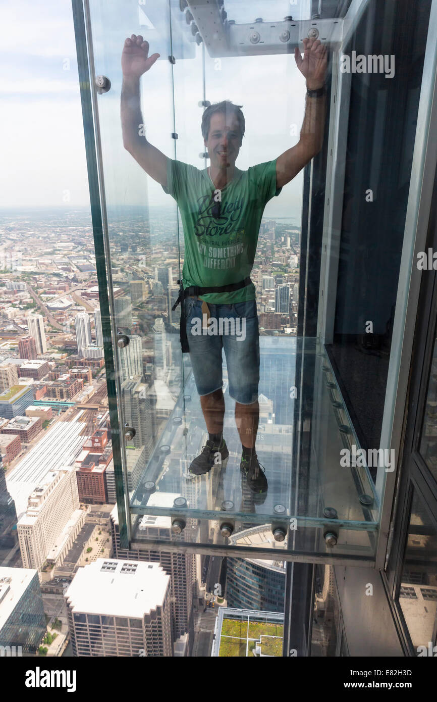 Chicago, Illinois, Chicago, Tourist on glass balcony of Willis Tower ...