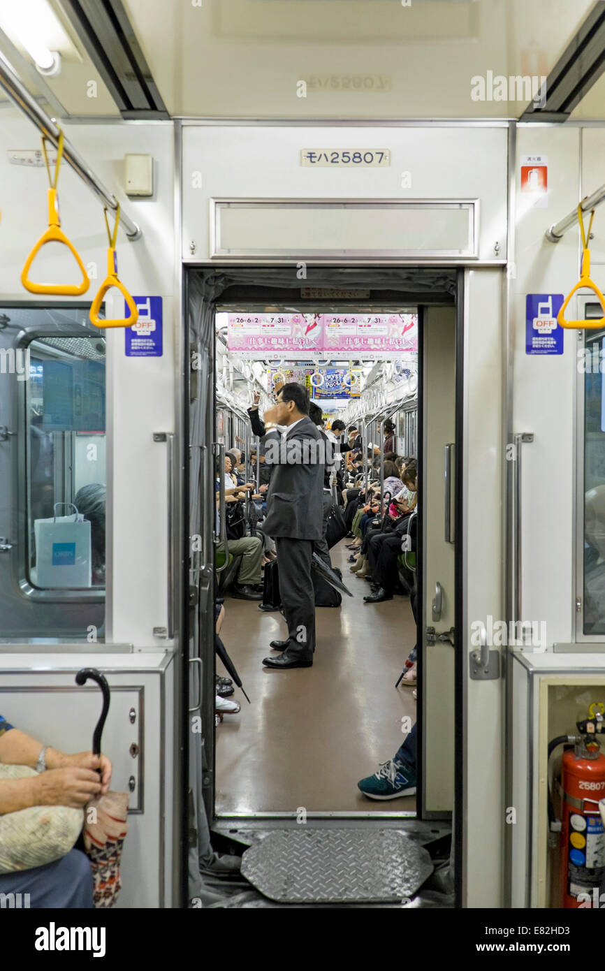 Japan, Tokyo, passengers in subway train Stock Photo - Alamy