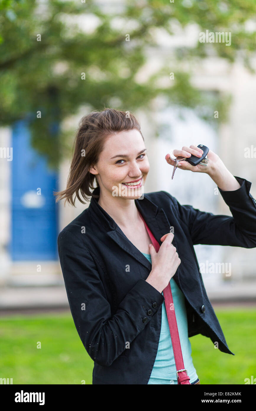 Happy woman with a keys Stock Photo - Alamy