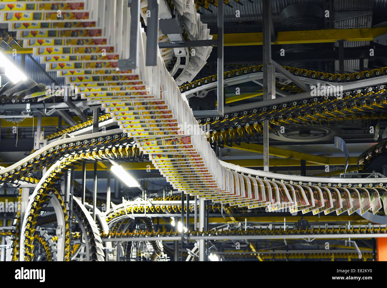 Germany, Conveyor belt with printed newspapers in a large printing company Stock Photo - Alamy