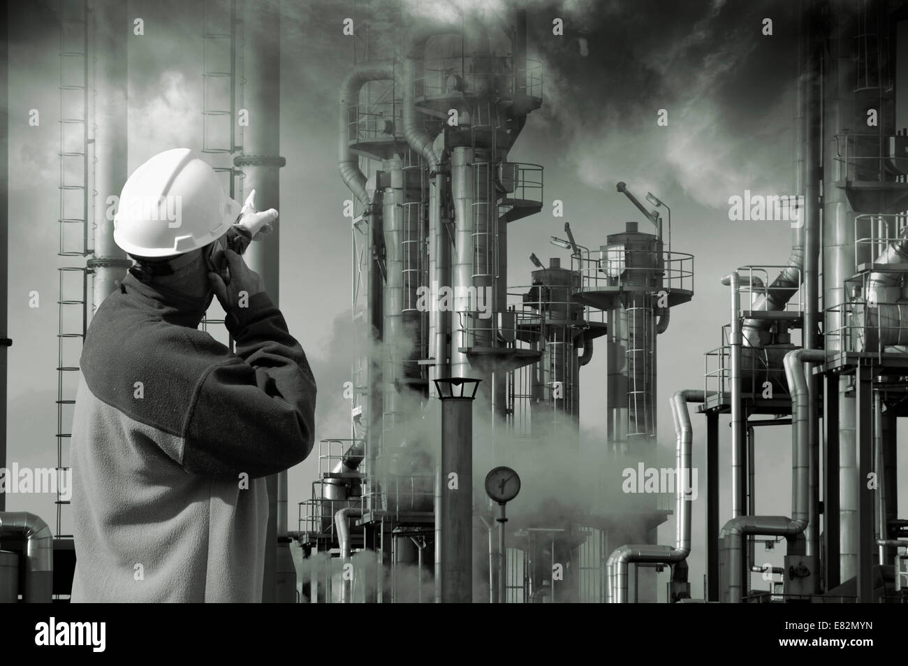 oil and gas worker inside large refinery Stock Photo - Alamy