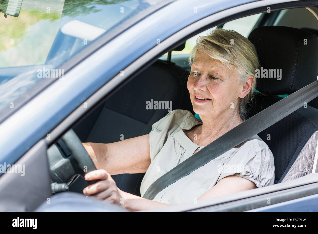 Senior driving her car Stock Photo - Alamy