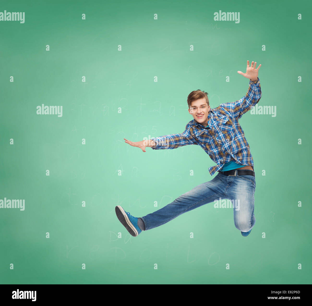 smiling young man jumping in air Stock Photo - Alamy