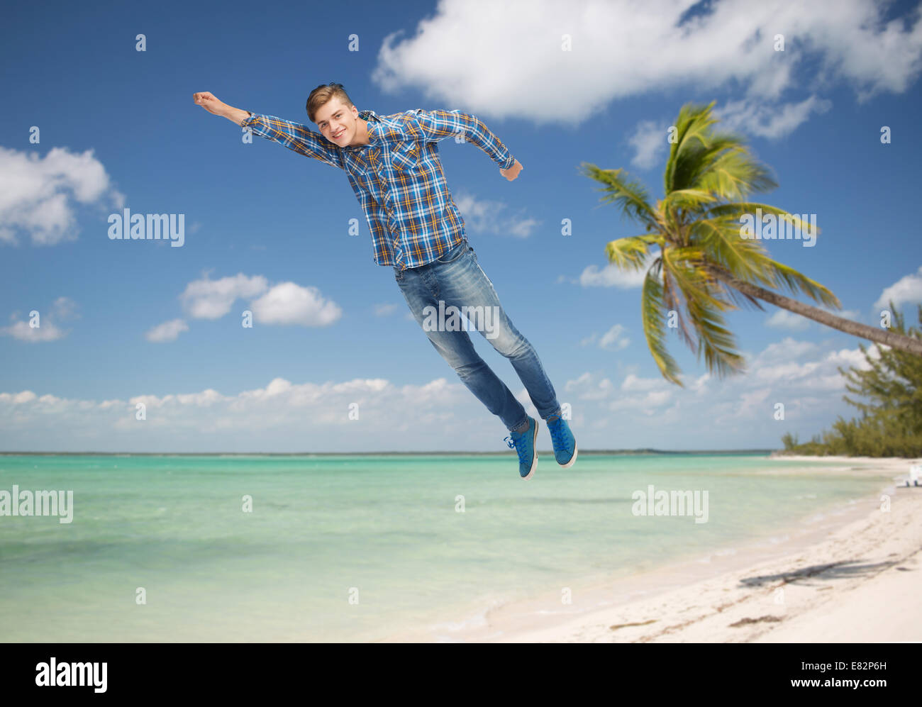 smiling young man flying in air Stock Photo - Alamy