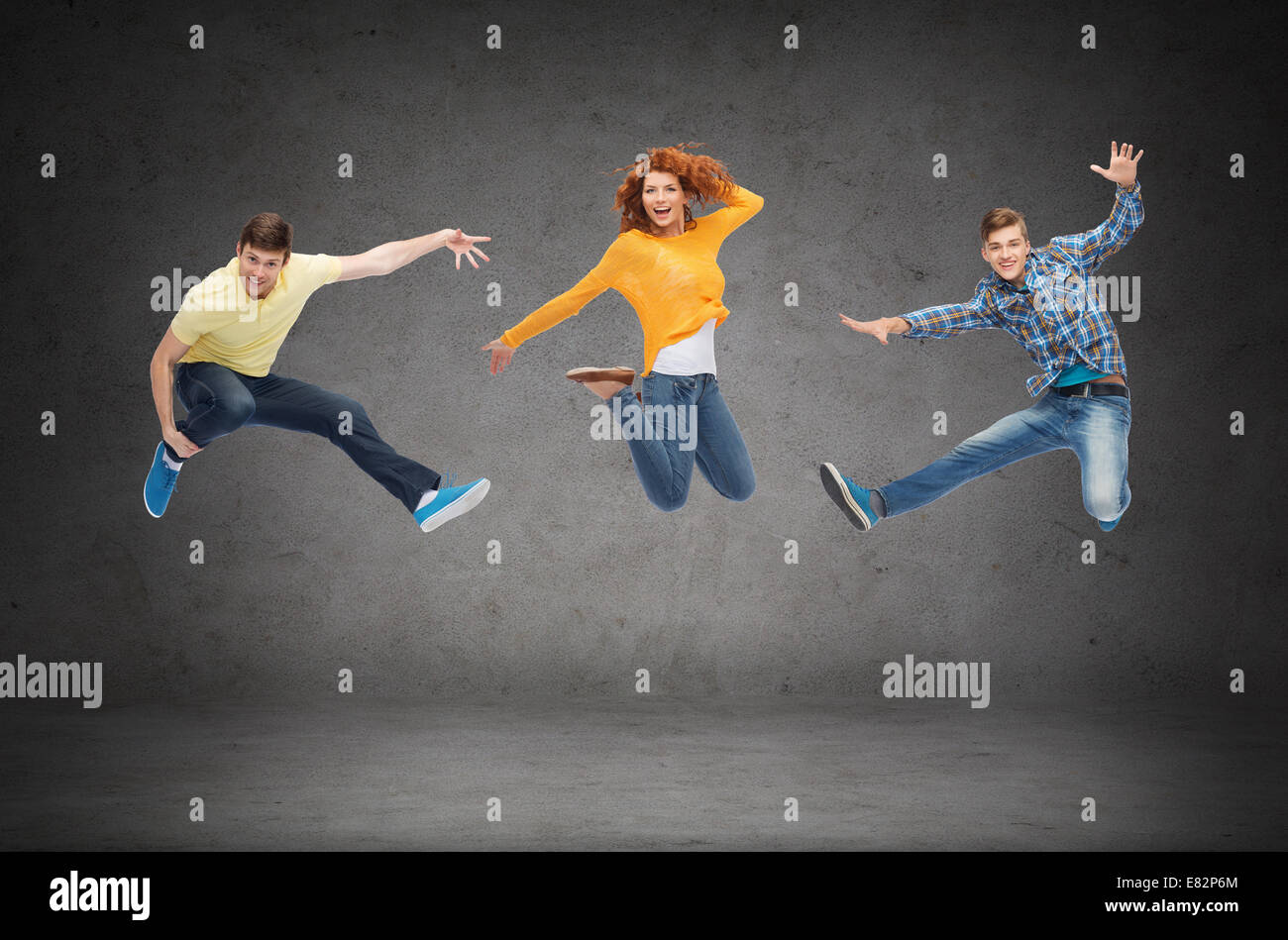 group of smiling teenagers jumping in air Stock Photo - Alamy