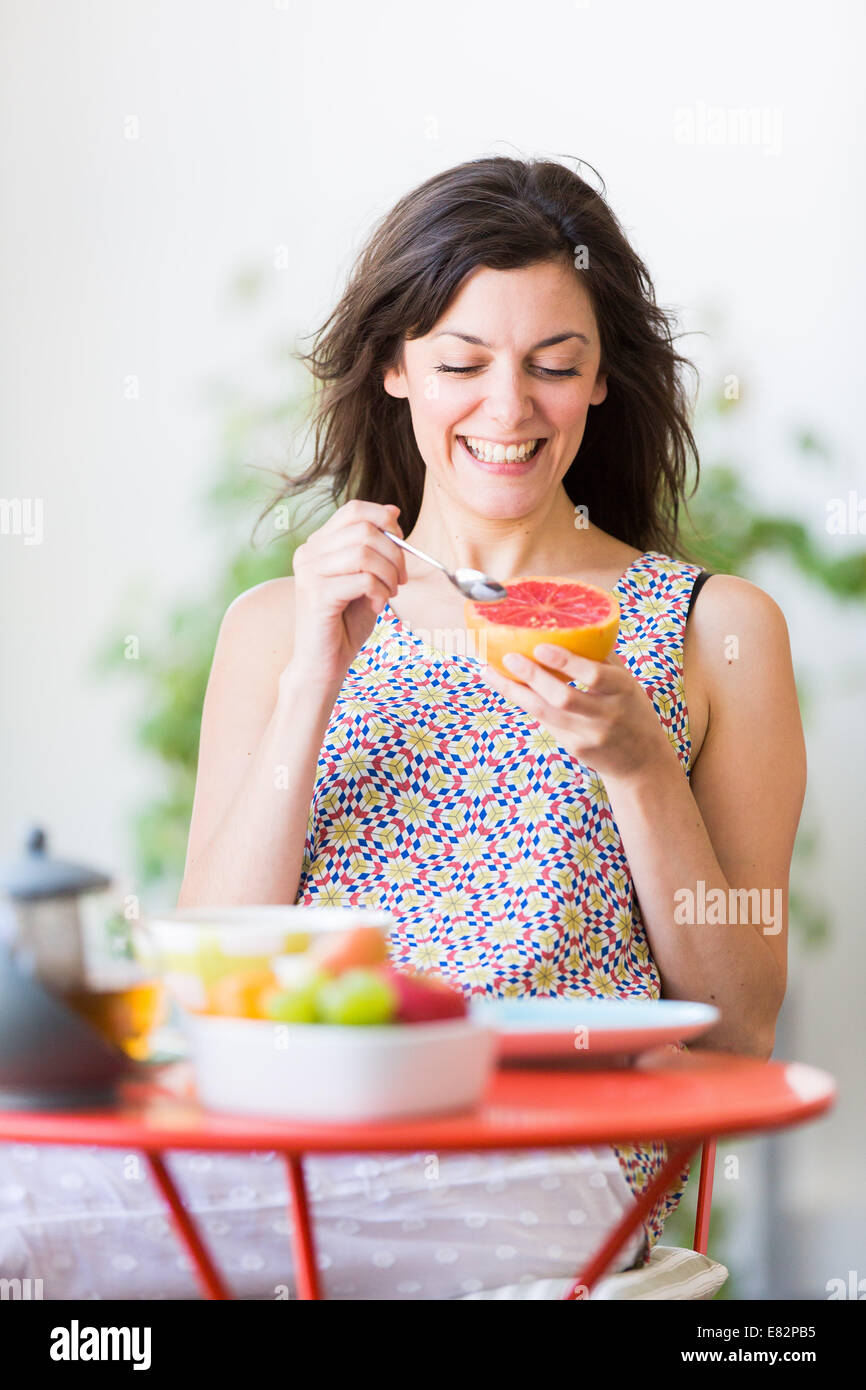 Woman having breakfast Stock Photo - Alamy