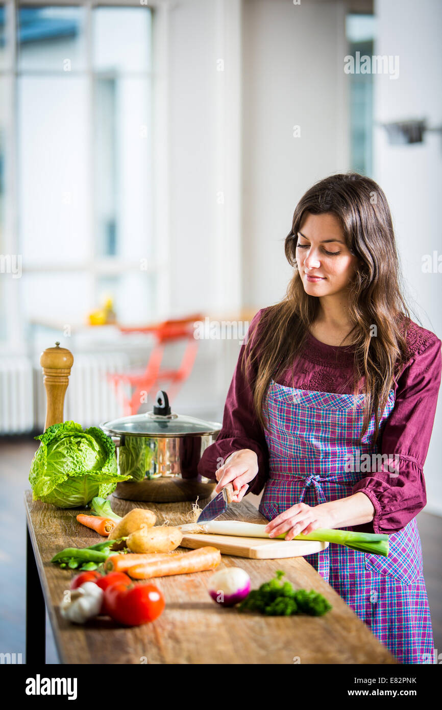Woman making soup Stock Photo - Alamy