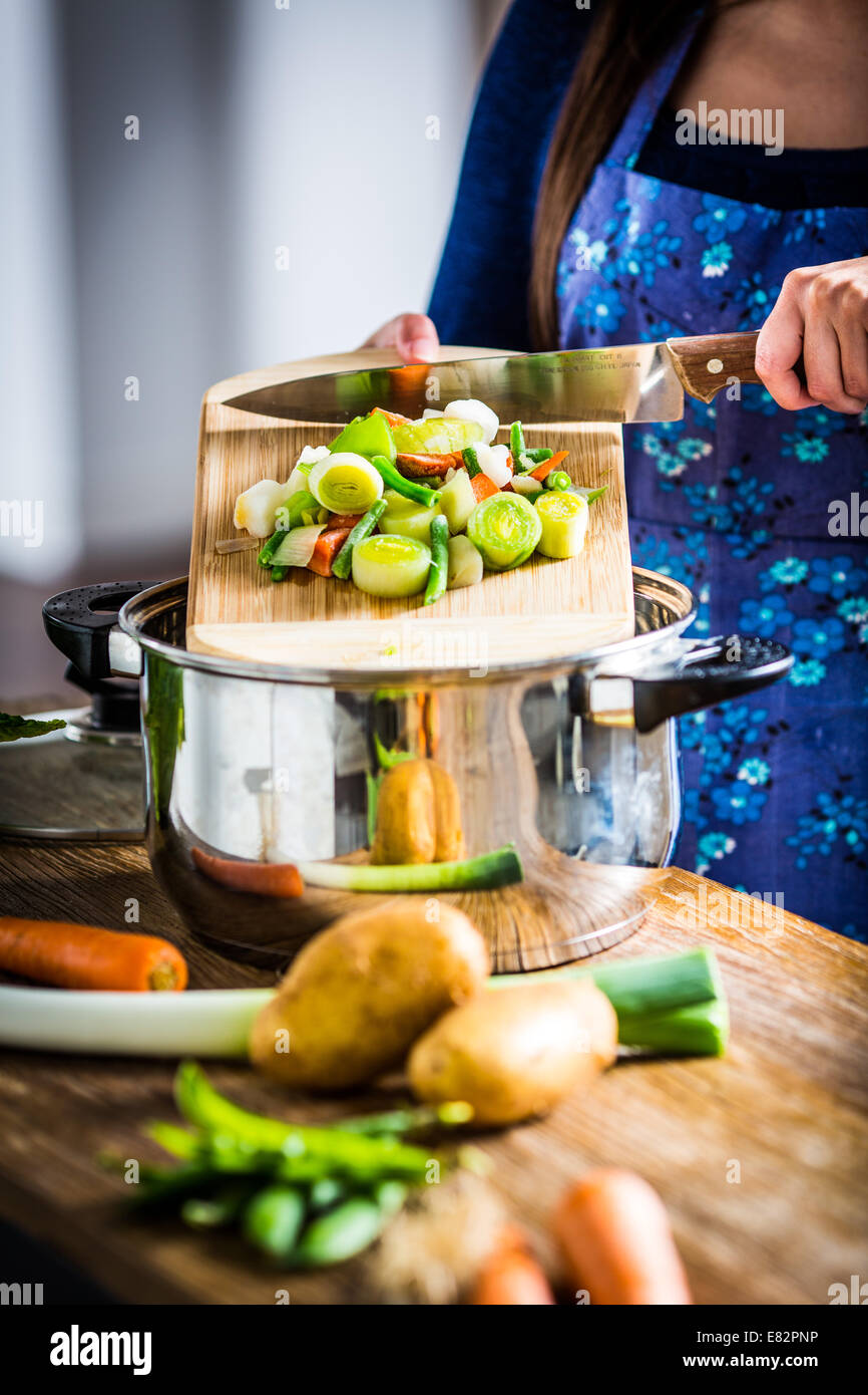Woman making soup Stock Photo - Alamy