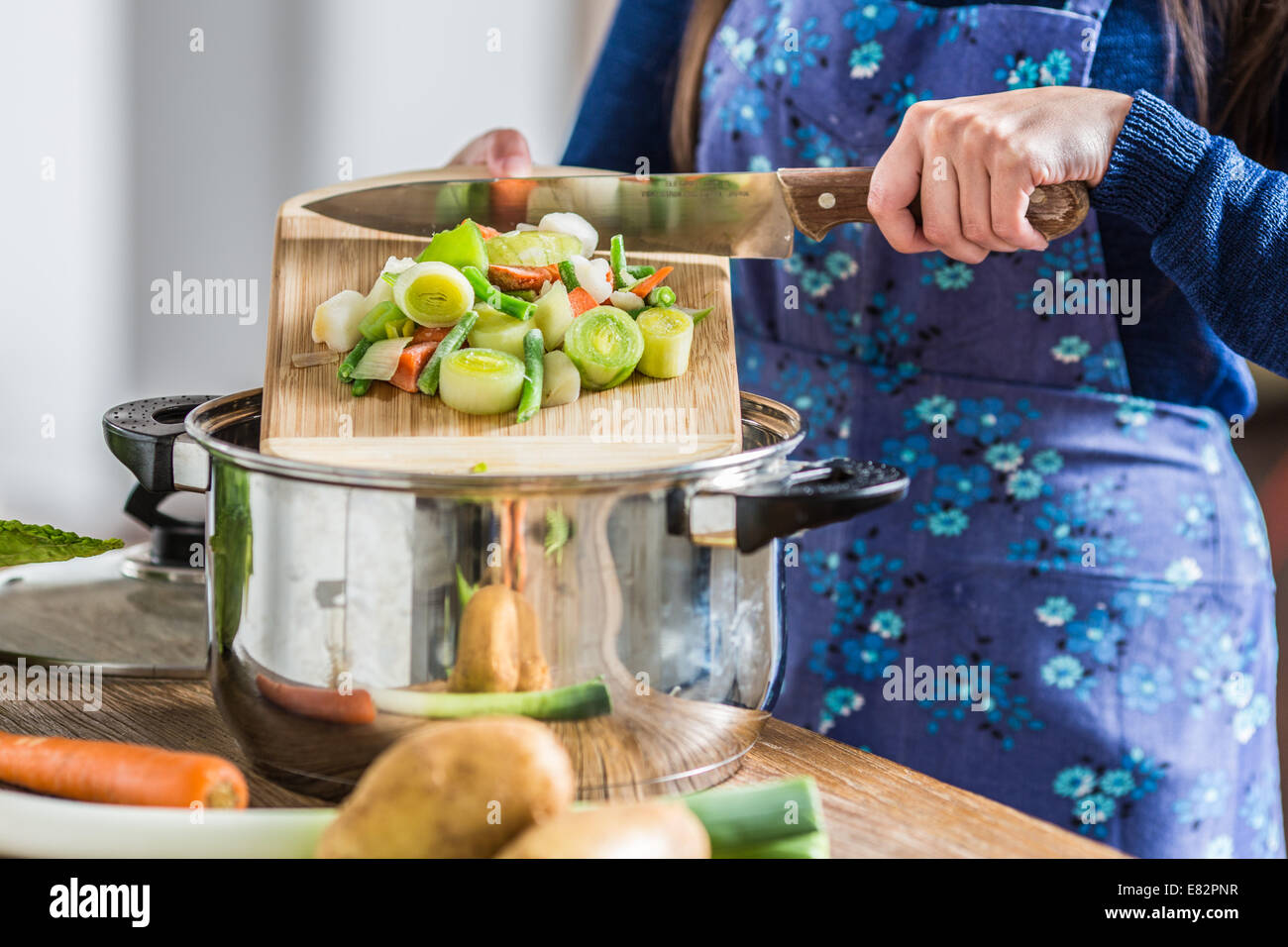Woman making soup Stock Photo - Alamy
