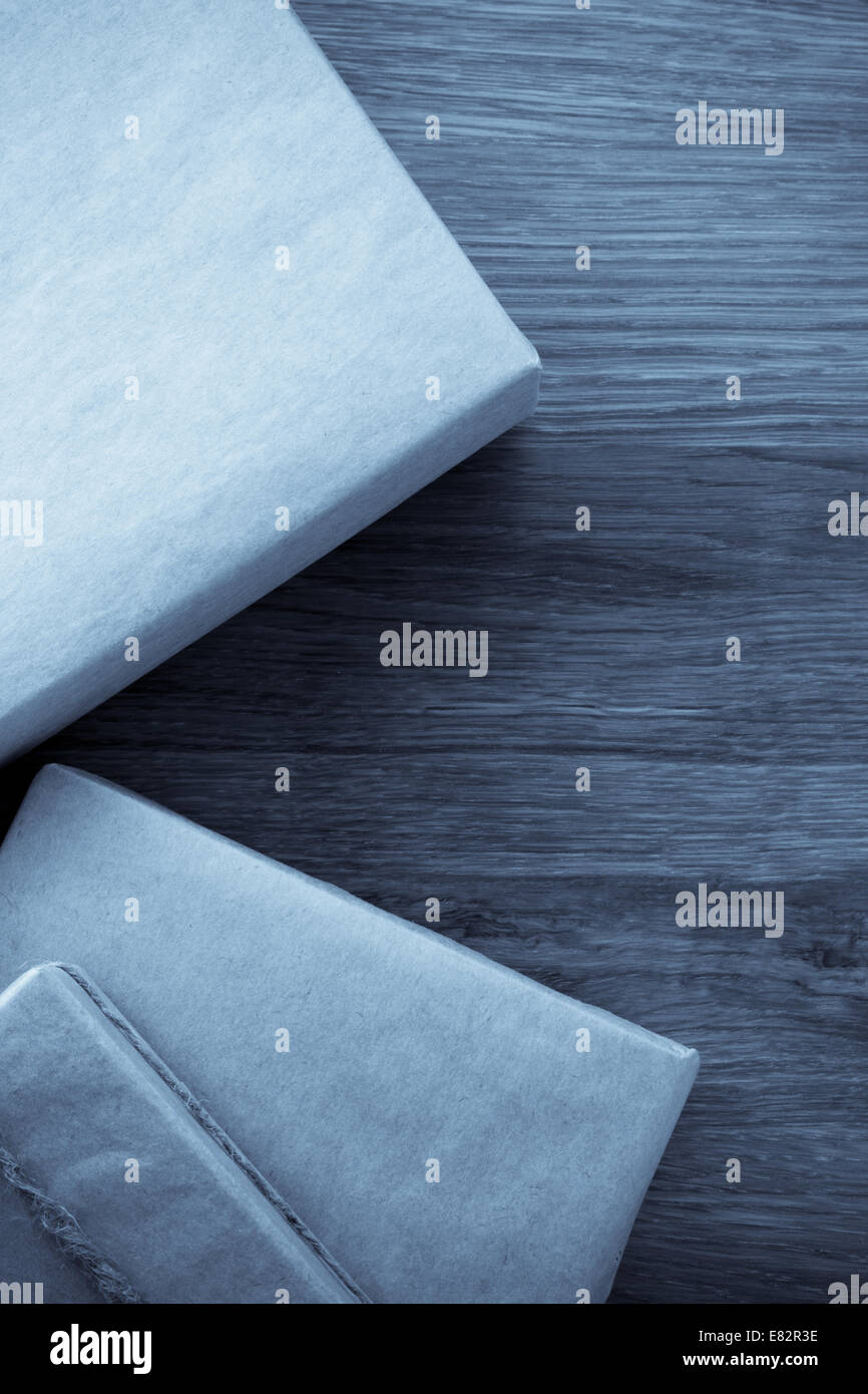 parcel wrapped packaged box on wooden background Stock Photo - Alamy