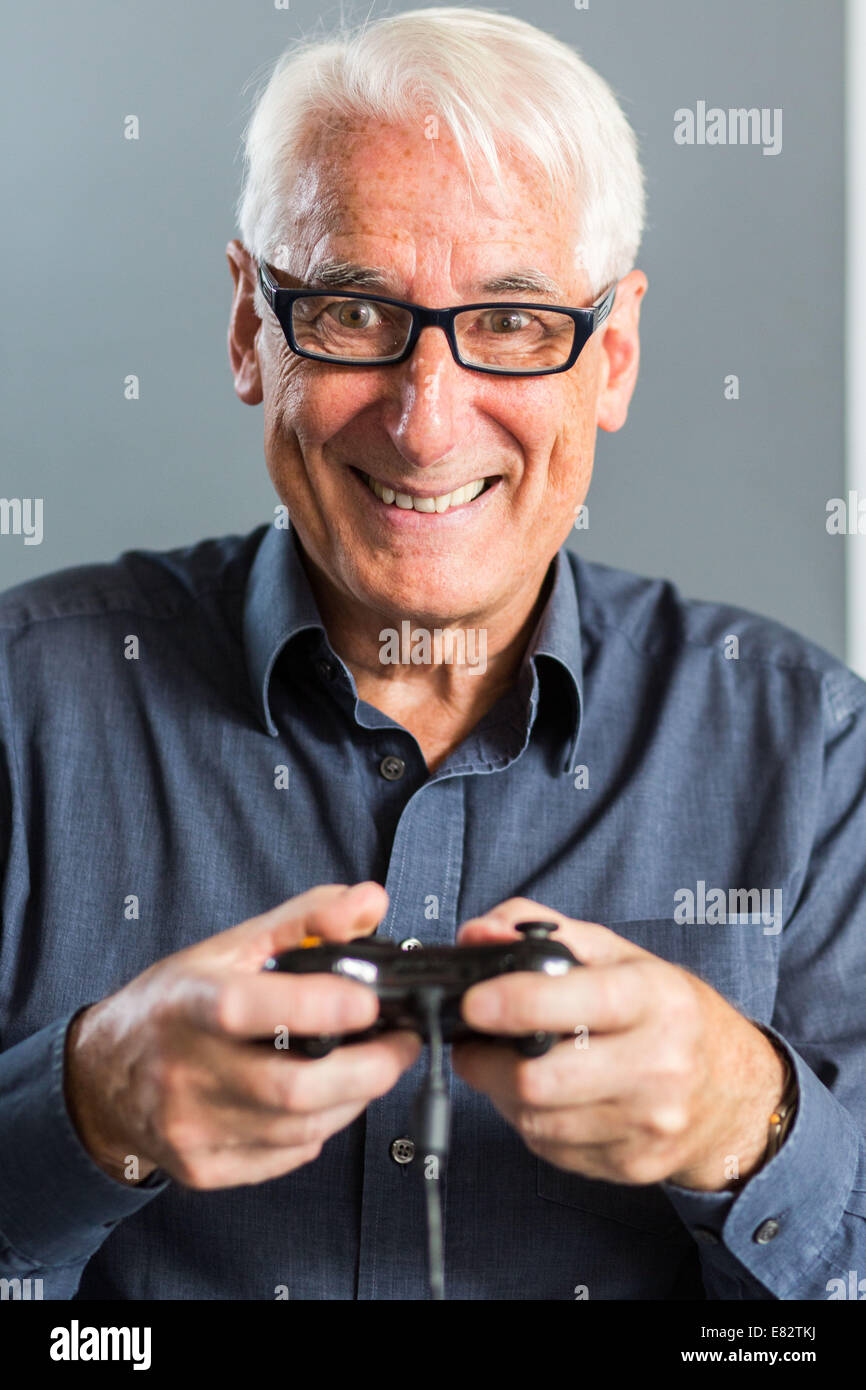 Senior playing a computer game Stock Photo - Alamy