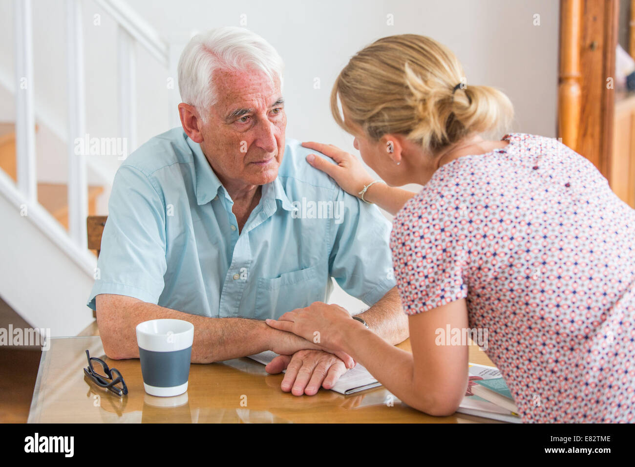Elderly man and daughter consoling hi-res stock photography and images ...