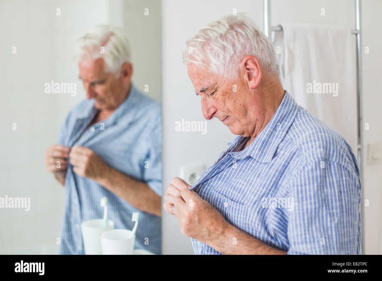 Man getting dressed inside hi-res stock photography and images - Alamy
