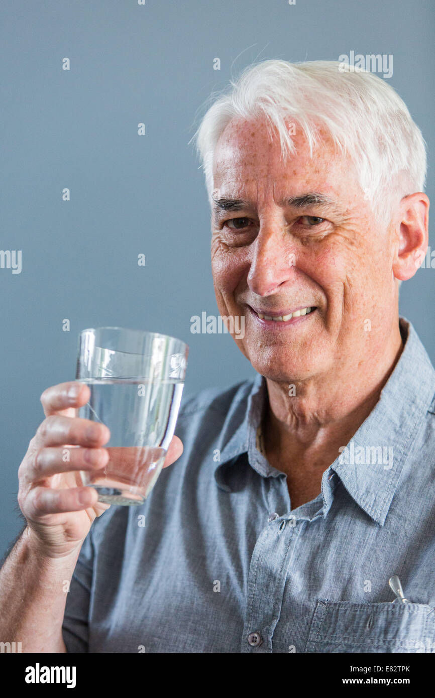 Man drinking glass of water Stock Photo - Alamy
