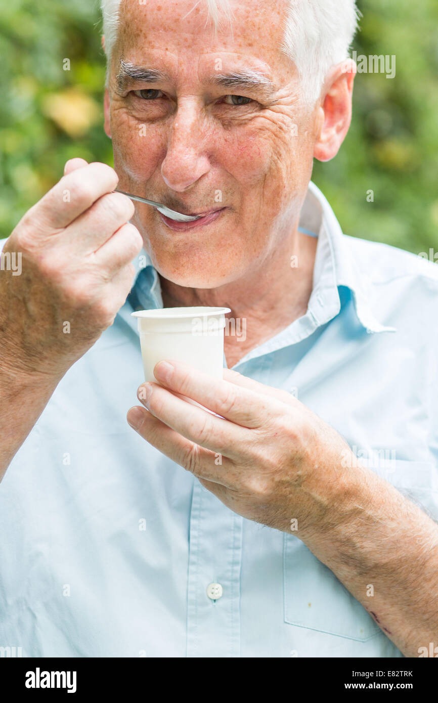 Eating yoghurt elderly hi-res stock photography and images - Alamy