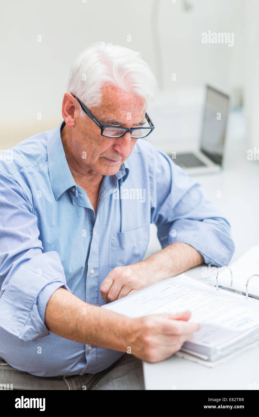 Man with administrative papers Stock Photo - Alamy
