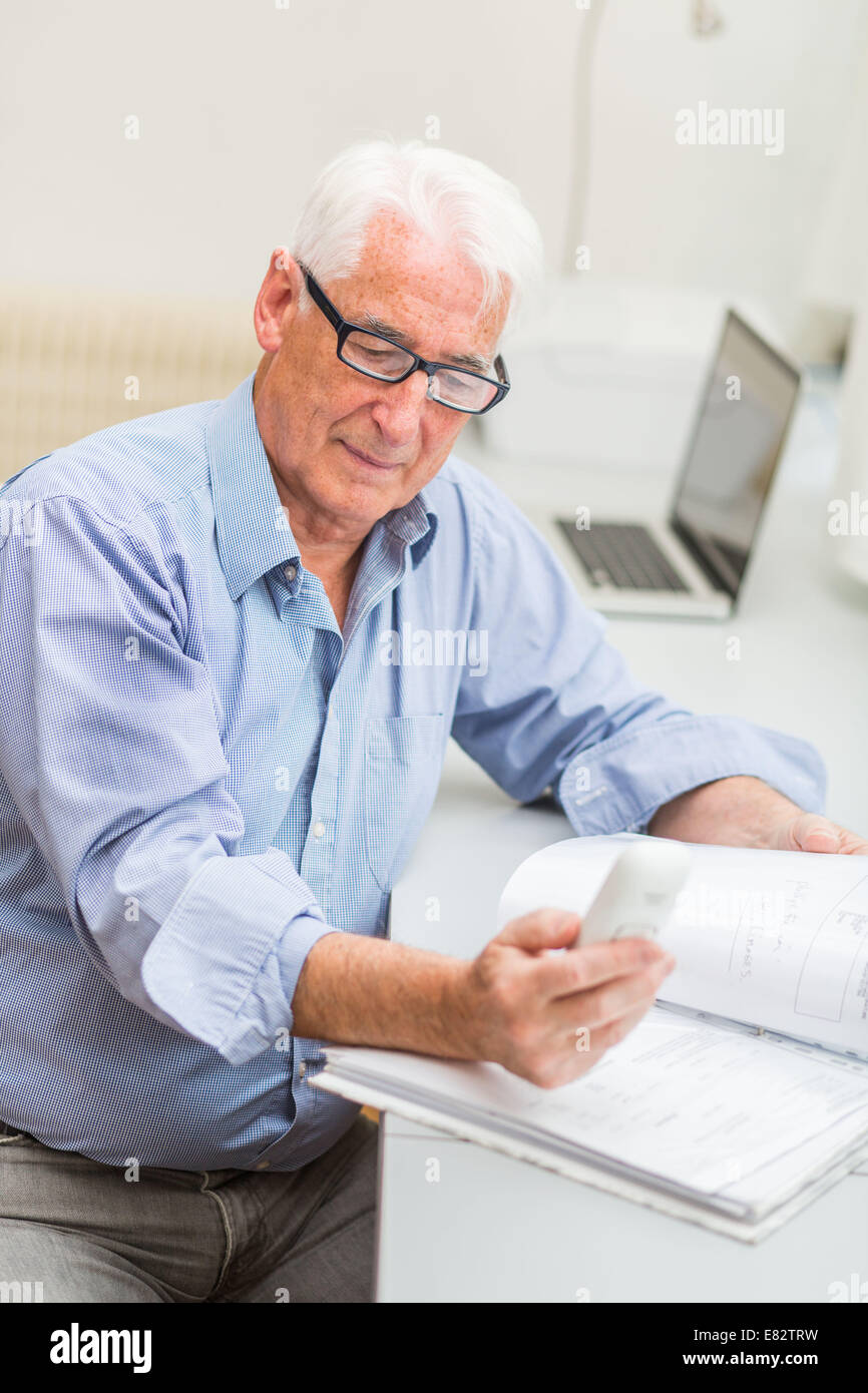 Man with administrative papers Stock Photo - Alamy
