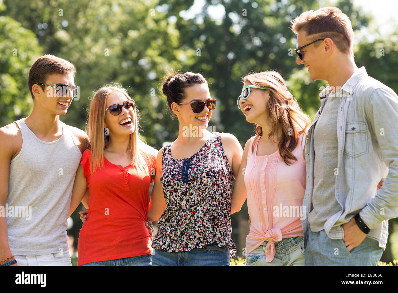 group of smiling friends outdoors Stock Photo - Alamy