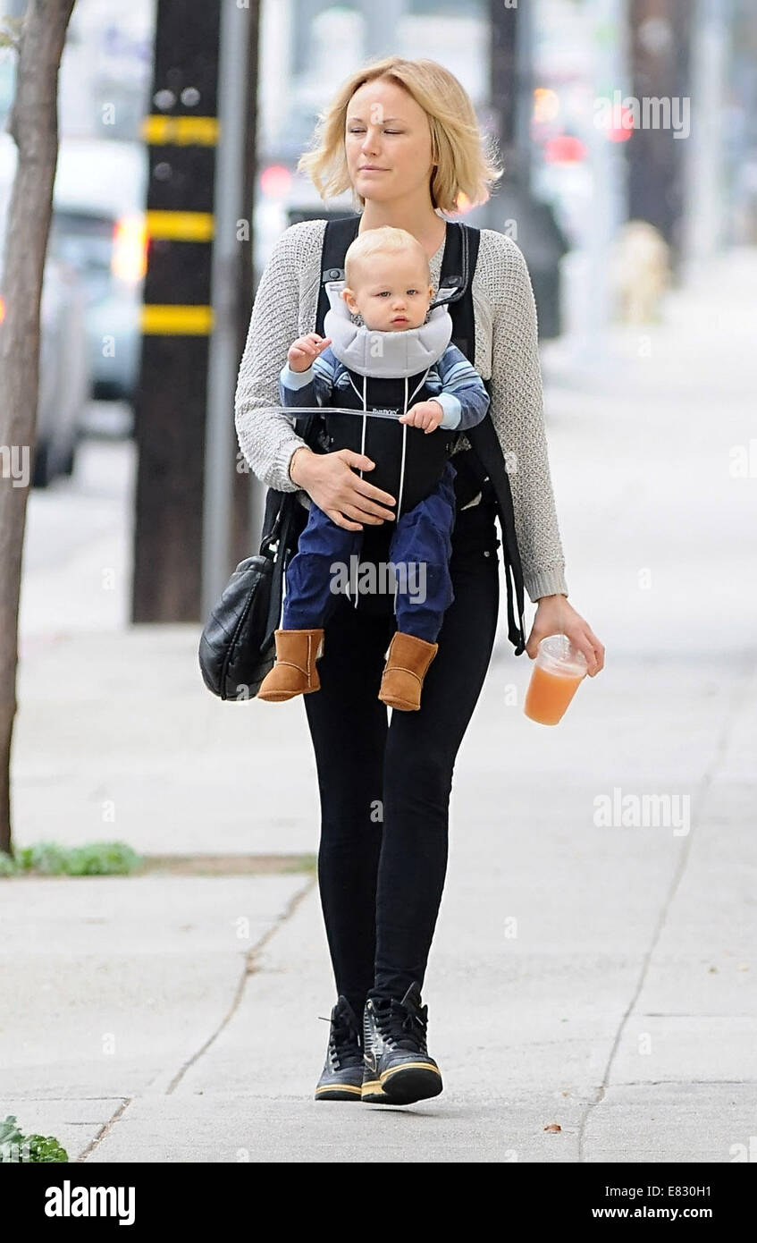 Malin Akerman out and about with son Sebastian, being carried in a ...