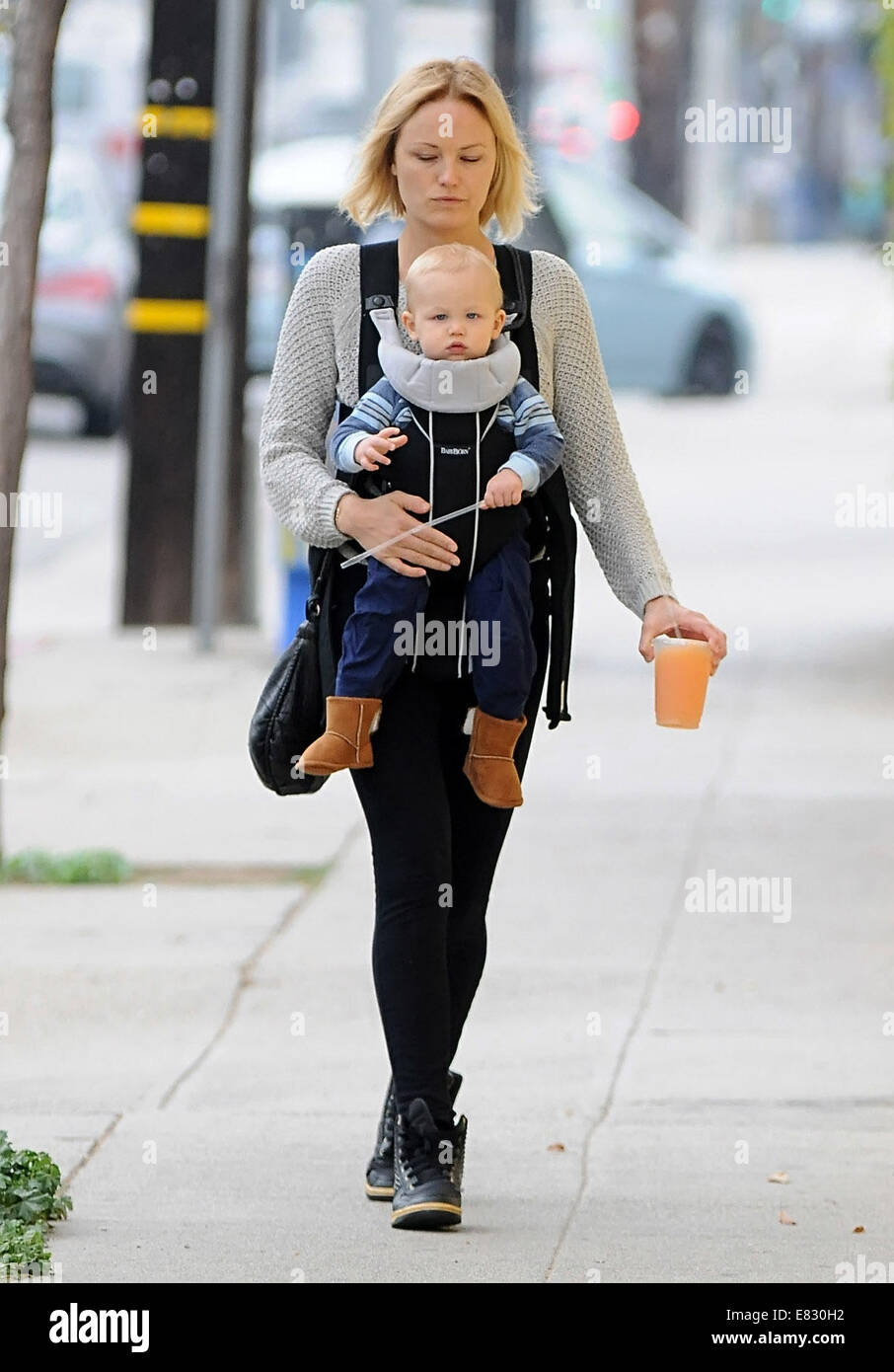 Malin Akerman out and about with son Sebastian, being carried in a ...