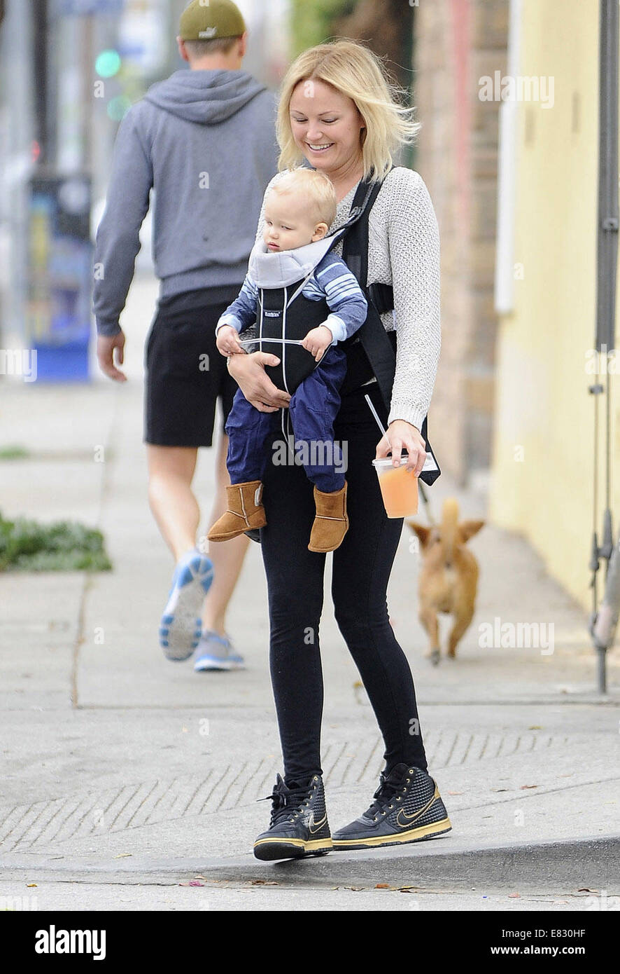Malin Akerman out and about with son Sebastian, being carried in a ...