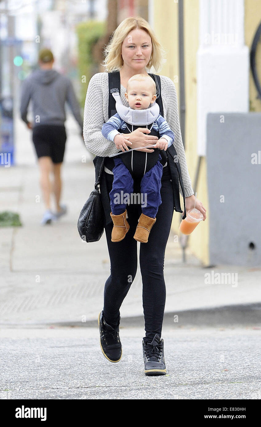Malin Akerman out and about with son Sebastian, being carried in a ...