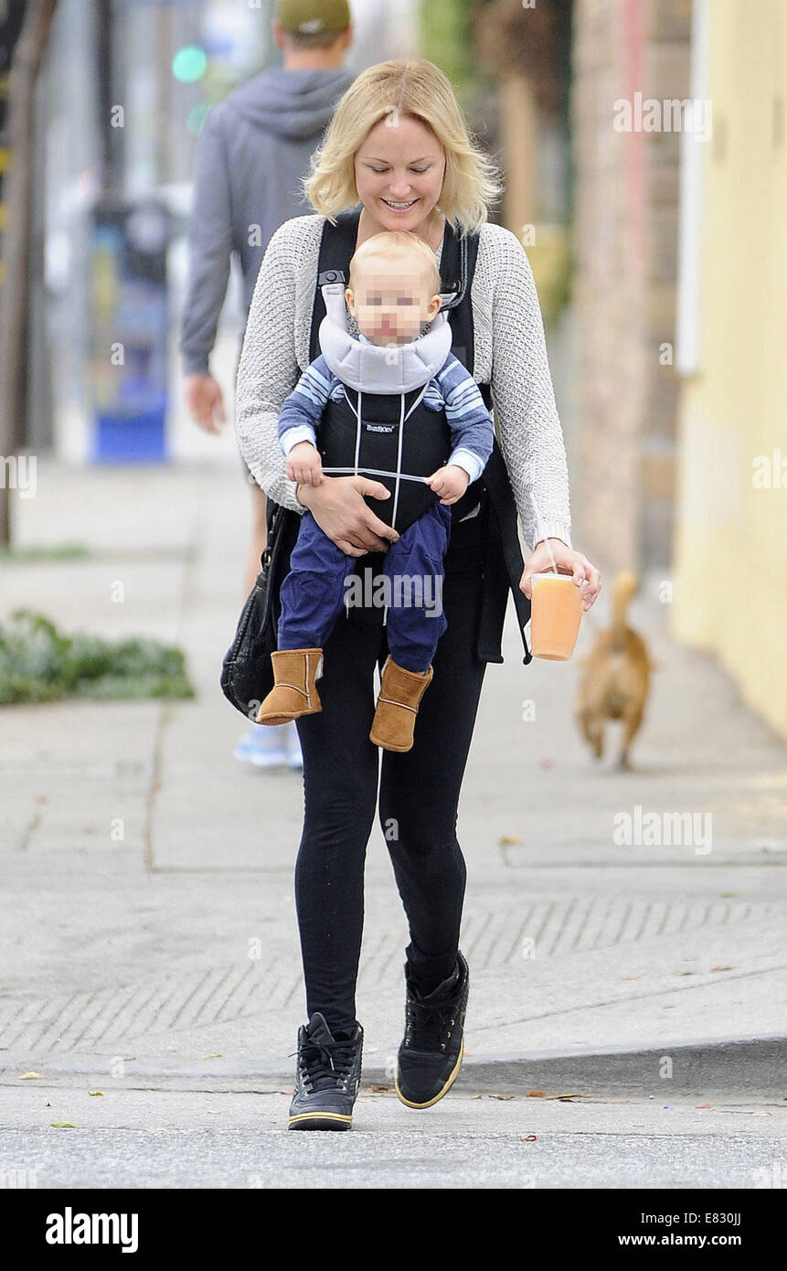Malin Akerman out and about with son Sebastian, being carried in a ...