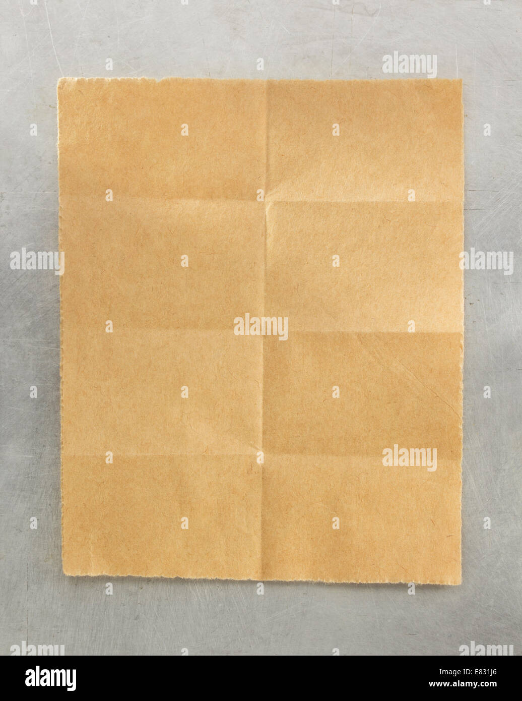 folded note paper at metal background Stock Photo - Alamy