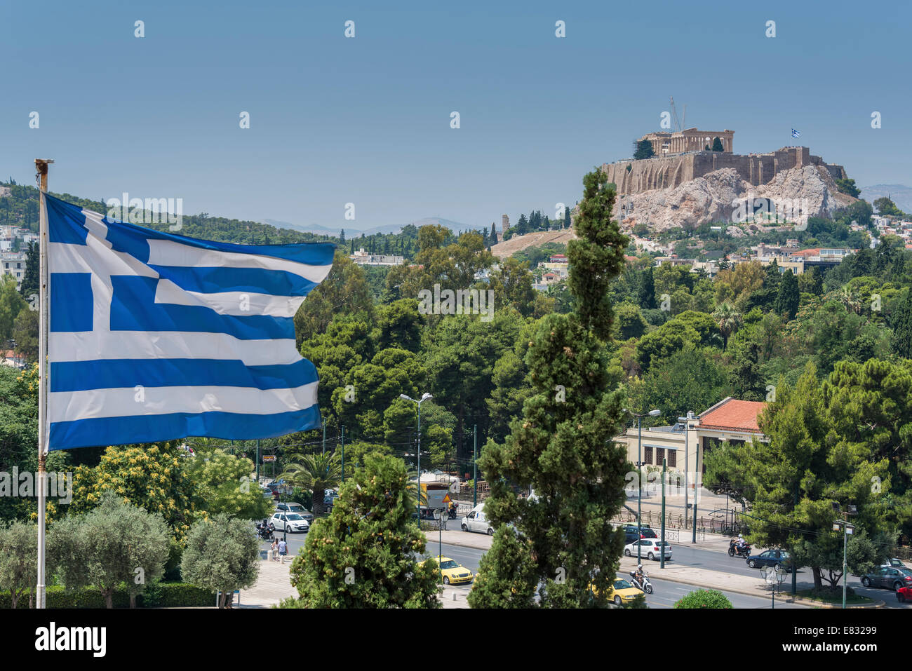 The Parthenon and the Acropolis in Athens from a distance with a Greek ...