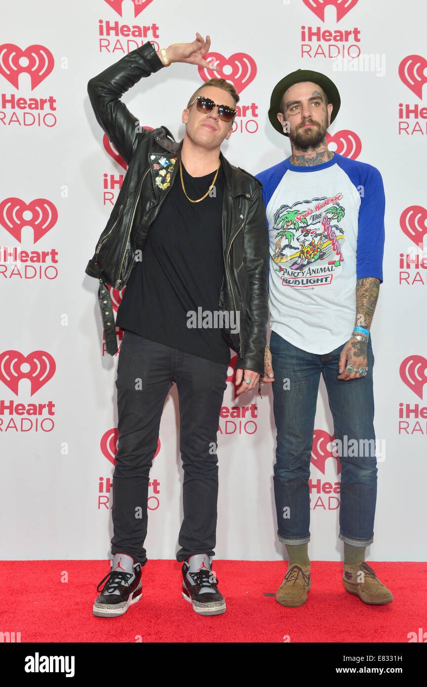 Rapper Macklemore (L) and musician Christopher Mansfield of Fences ...