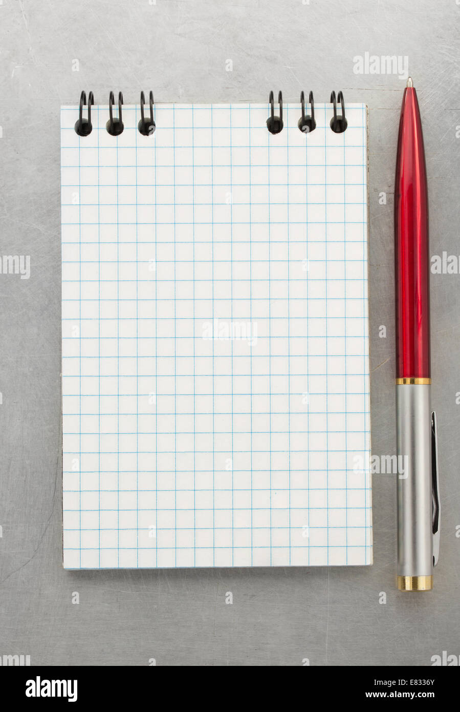 checked notebook at metal background texture Stock Photo - Alamy