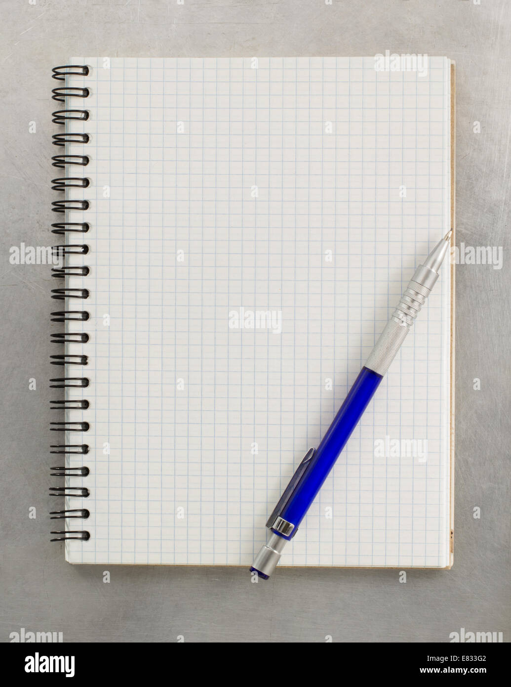 checked notebook at metal background texture Stock Photo - Alamy