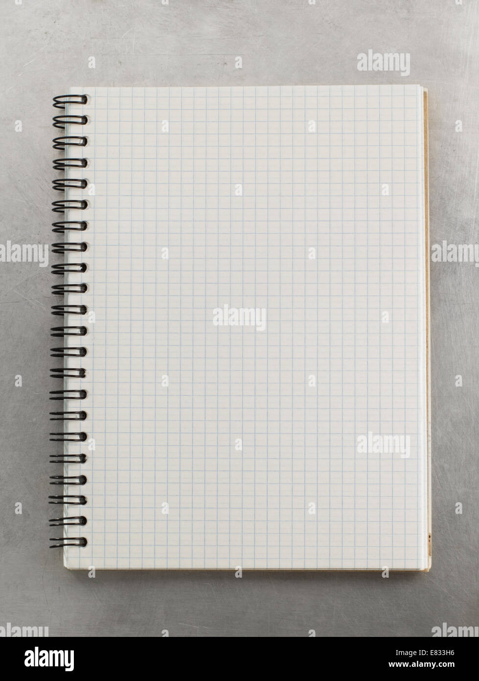 checked notebook at metal background texture Stock Photo - Alamy