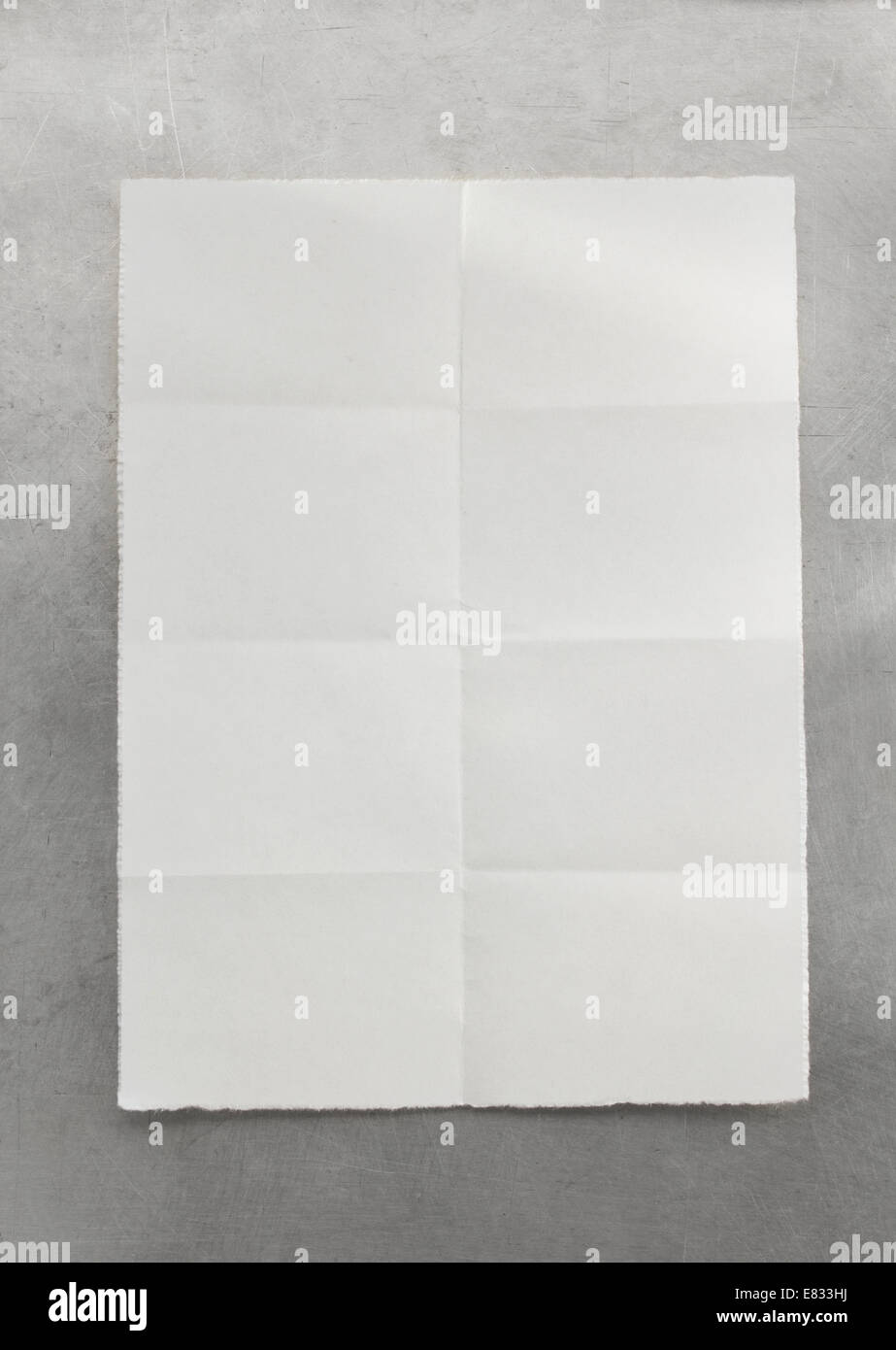 folded note paper at metal background Stock Photo - Alamy