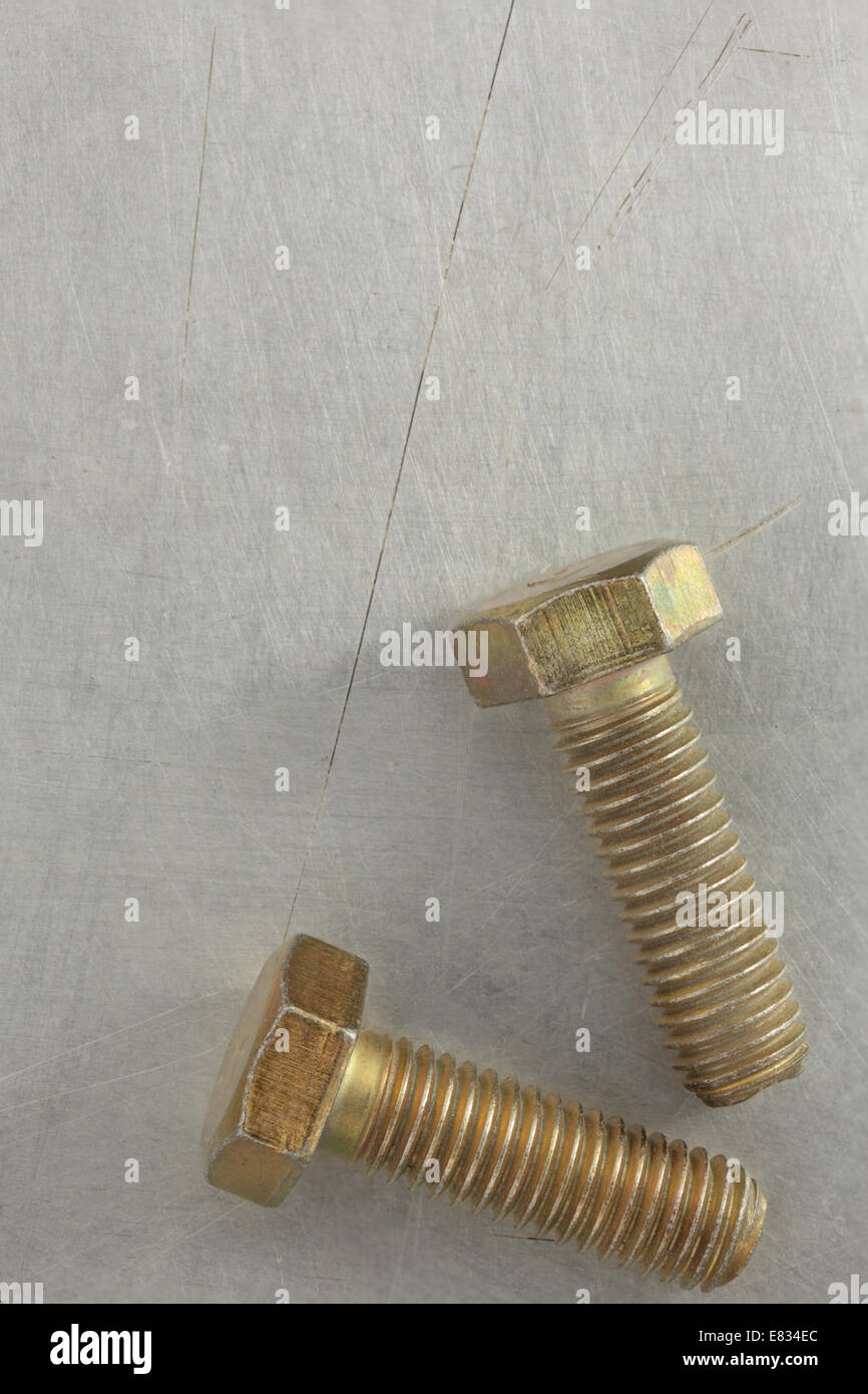 bolts tool at metal background texture Stock Photo - Alamy