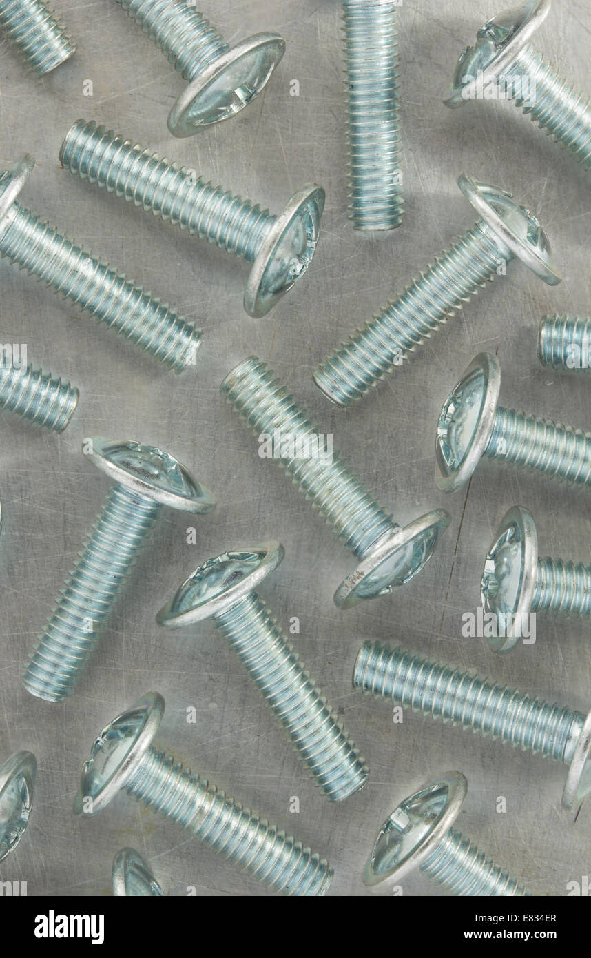 bolts tool at metal background texture Stock Photo - Alamy
