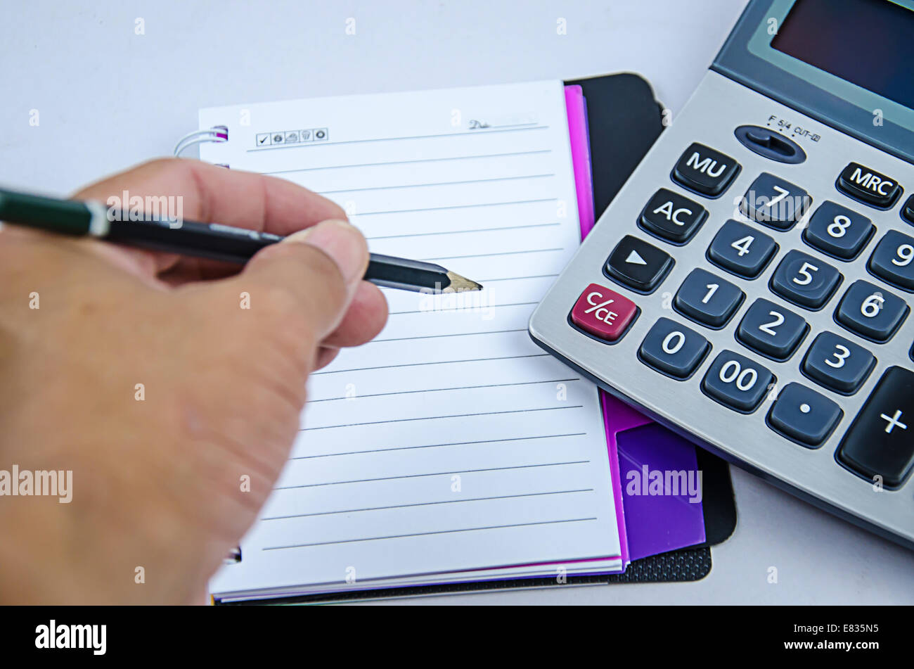 notebook pencil and calculator on white background Stock Photo - Alamy