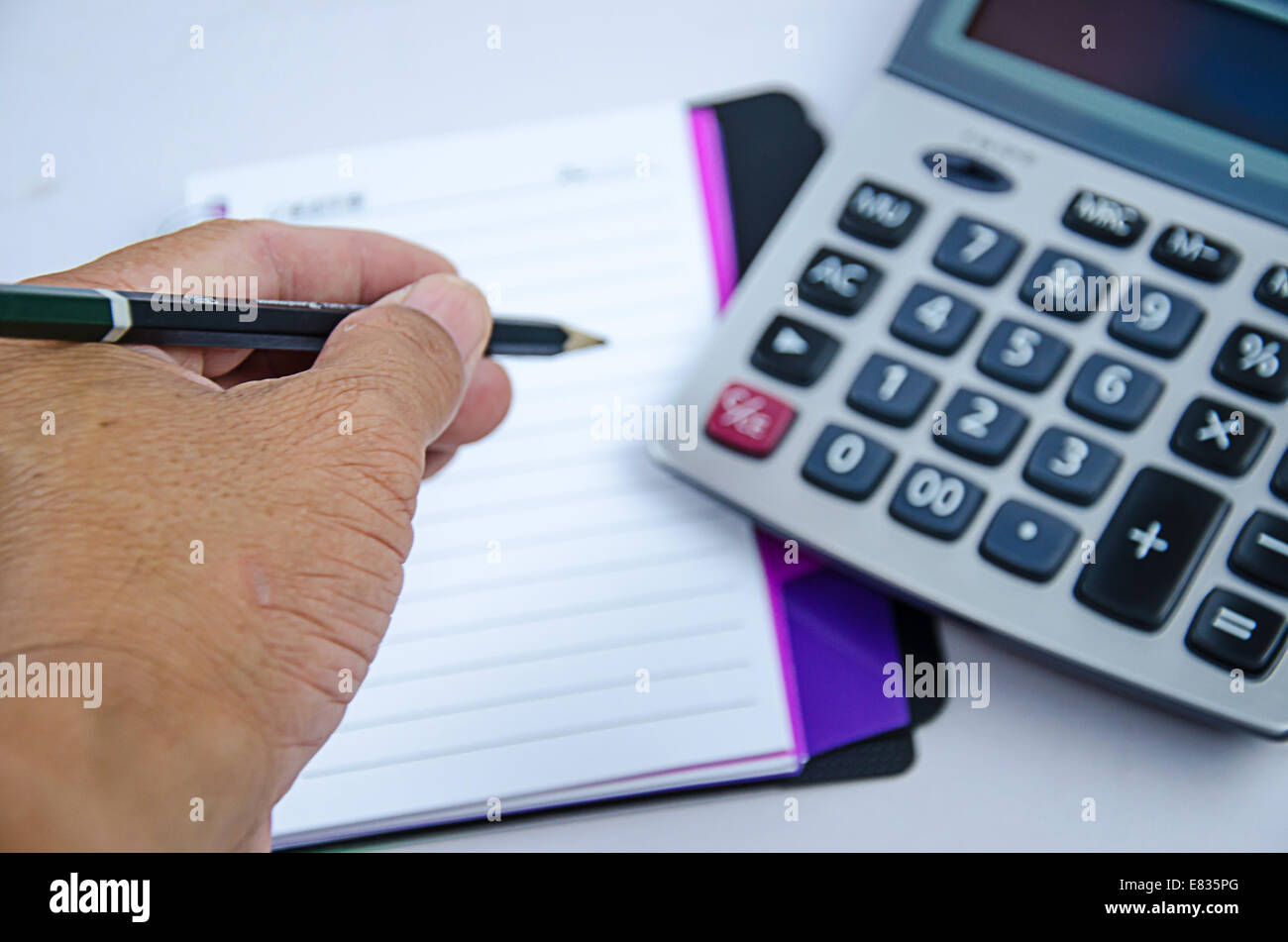 Hand calculator hi-res stock photography and images - Alamy