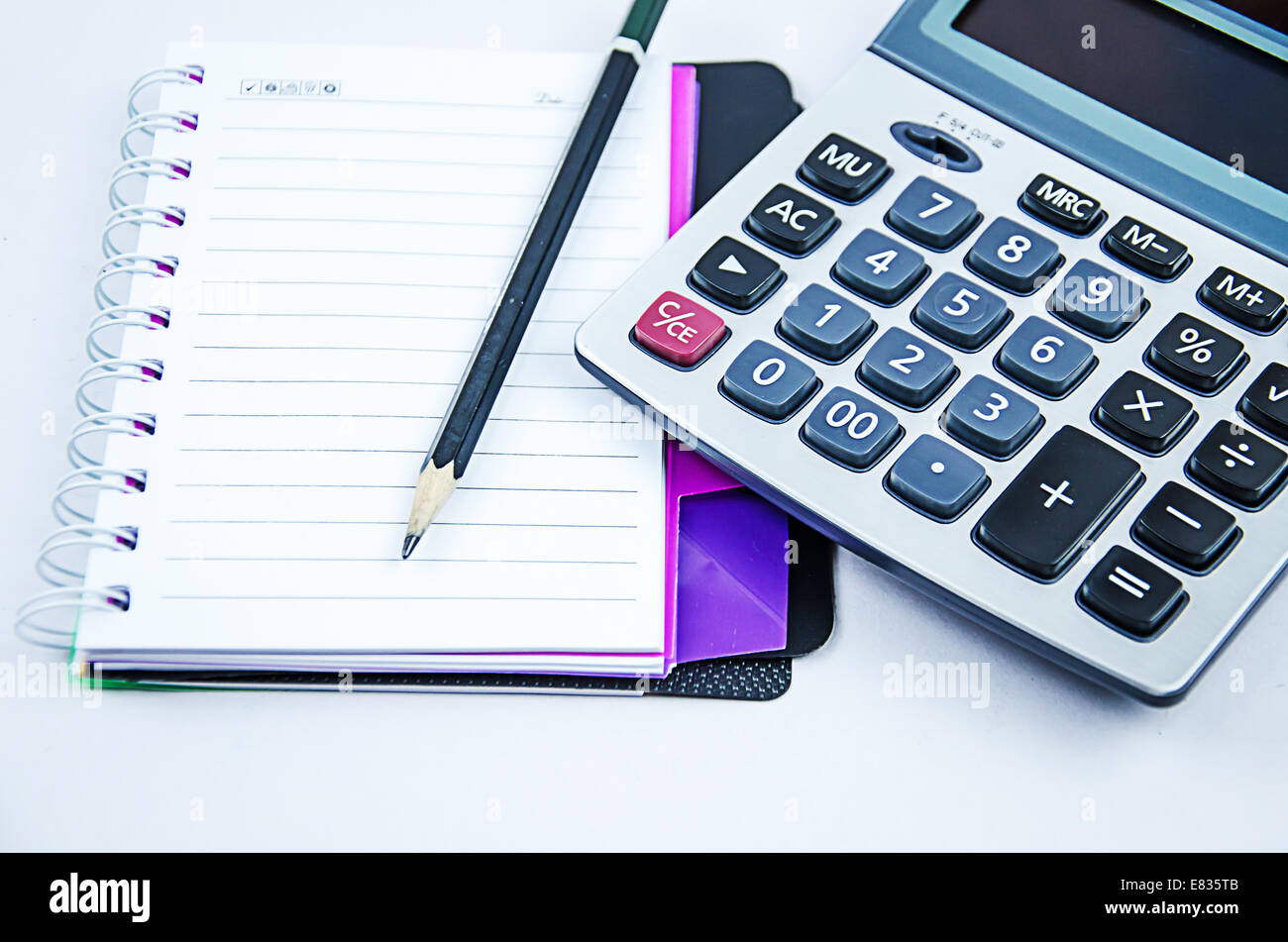 notebook pencil and calculator on white background Stock Photo - Alamy