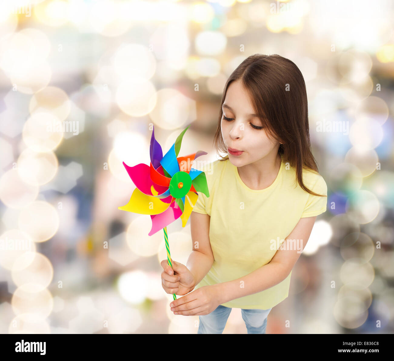 smiling child with colorful windmill toy Stock Photo - Alamy