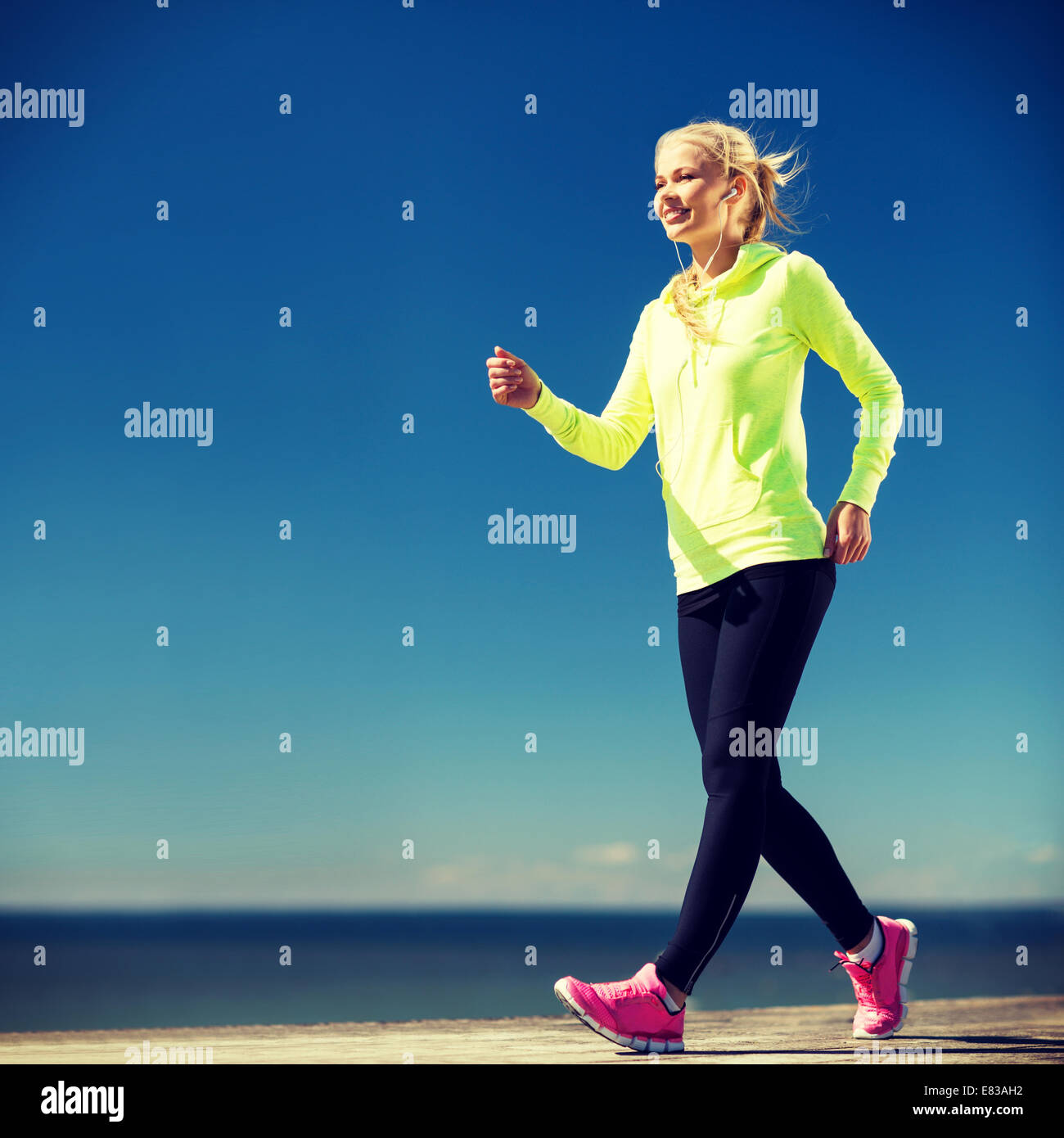 woman walking outdoors Stock Photo - Alamy