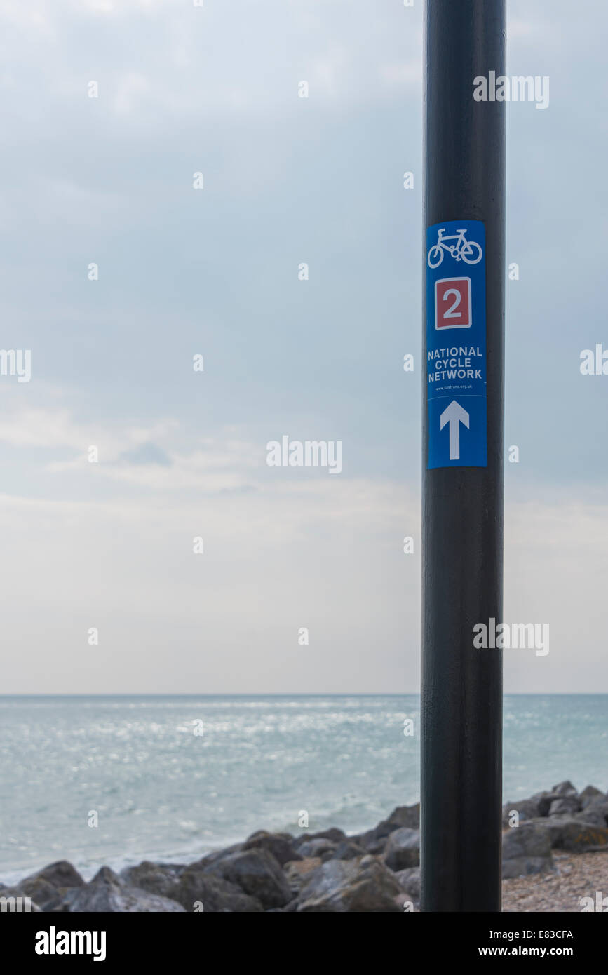 National cycle route direction sign on a lamp post by the sea Stock ...
