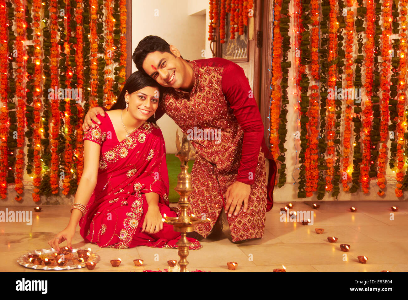 Hand holding diya hi-res stock photography and images - Alamy