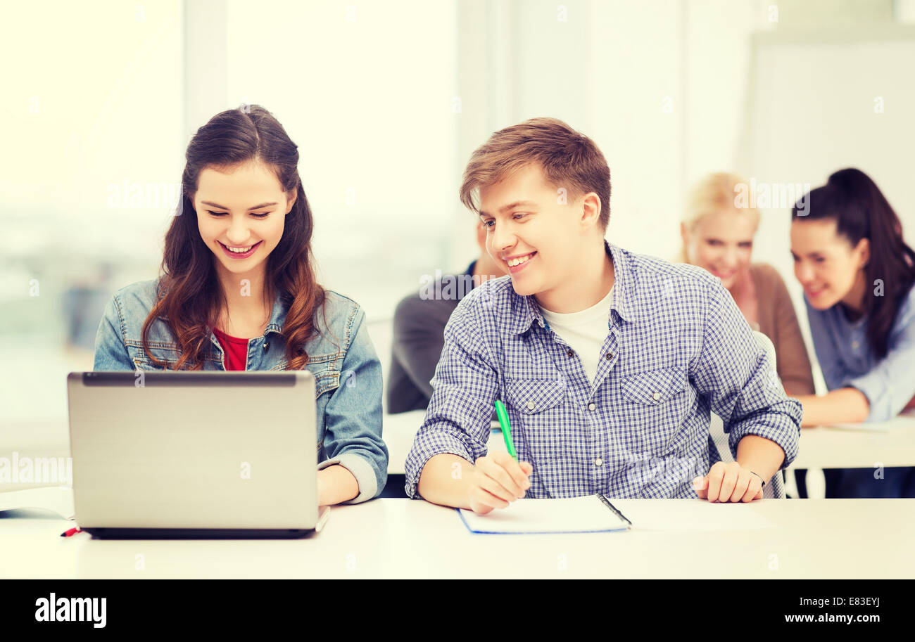students with laptop and notebooks at school Stock Photo - Alamy